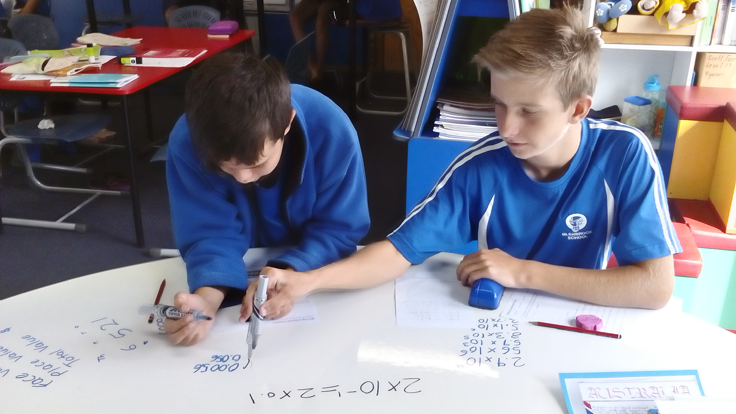 Collaboratively solving mathematical problems on the whiteboard table ...